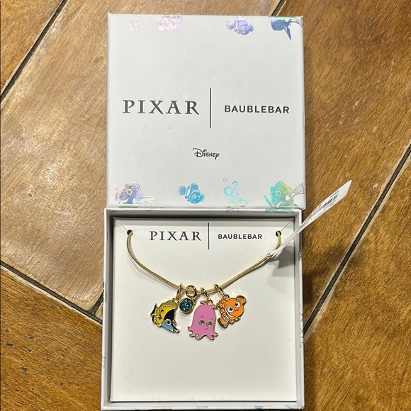 BaubleBar | Jewelry | Baublebar Gold Tone Necklace With Pixar Charms ...